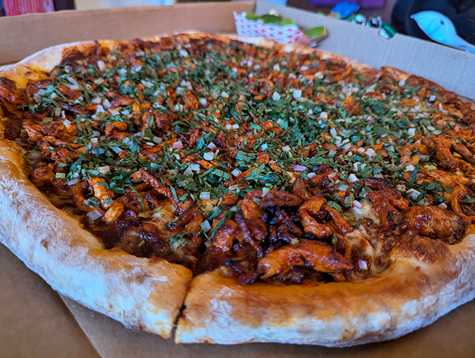 BBQ chicken pizza that doesn't hold back. Fresh cilantro and onions cut through the sweet-savory sauce, creating a flavor explosion worthy of fireworks.