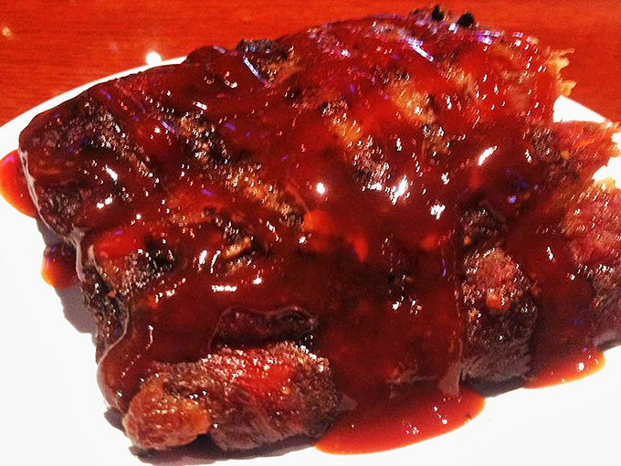 Glistening with sauce and tender enough to make you weep. These ribs don't just fall off the bone&mdash;they practically leap into your mouth.
