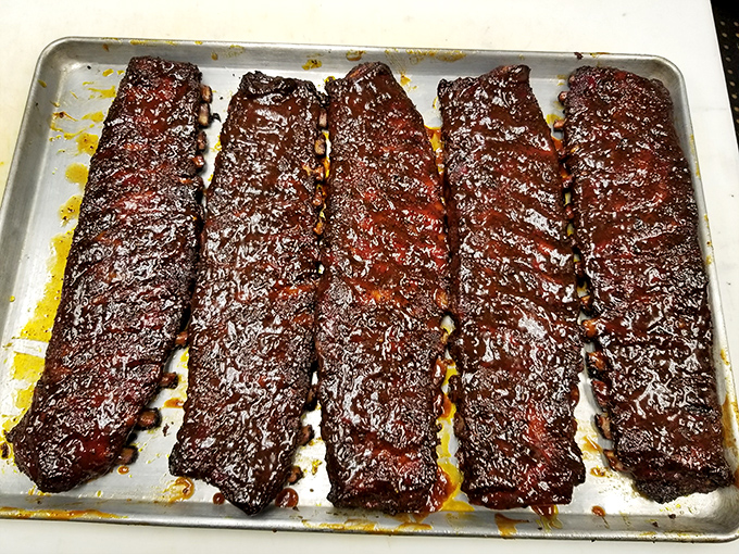 Ribs glistening with that mahogany sheen that says, "We've been cooking since yesterday, just for you." Napkins are not optional.