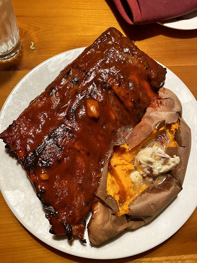 Ribs glazed with a sauce so shiny you could check your reflection before diving face-first into barbecue bliss.