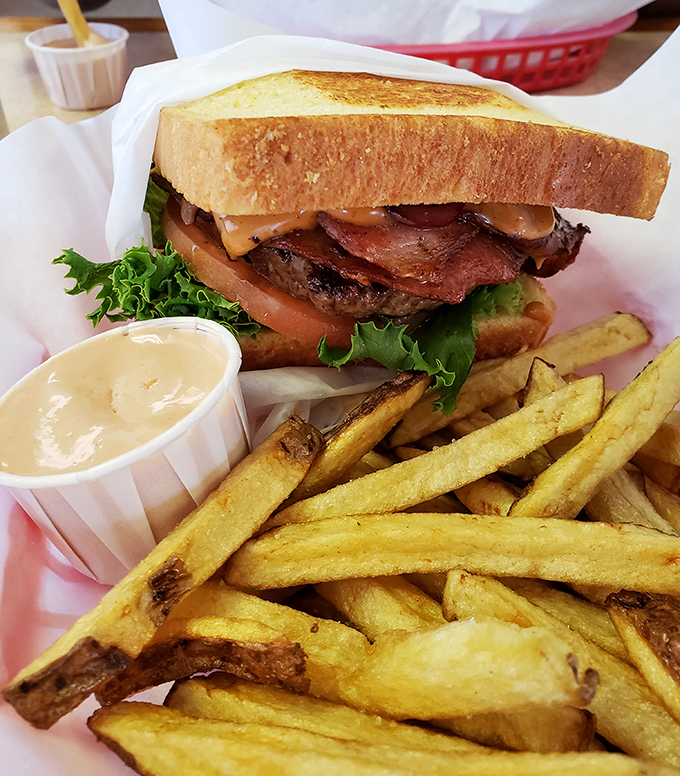 This isn't just a sandwich&mdash;it's architecture. Layers of flavor stacked between Texas toast with crispy fries standing guard.