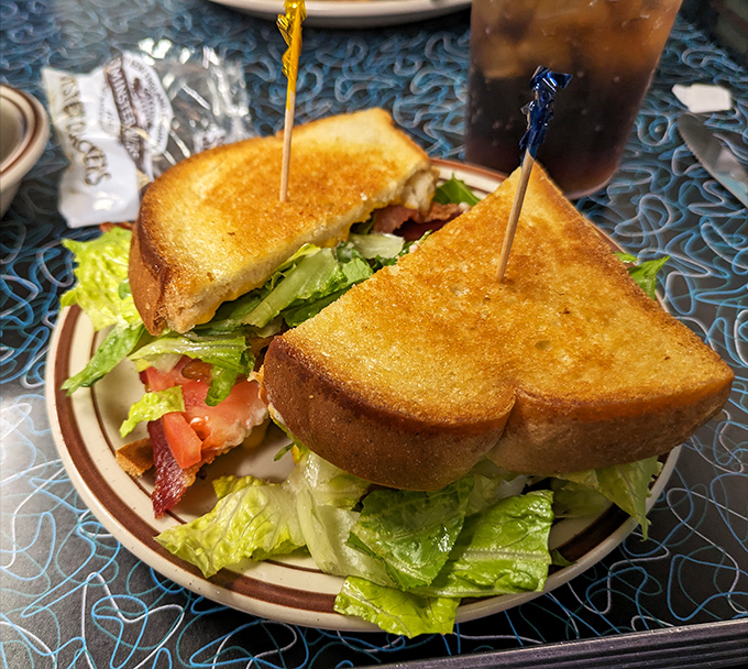 The perfect BLT isn't just a sandwich&mdash;it's architecture. Notice how those golden toast triangles stand proudly, guarding their treasure of bacon.