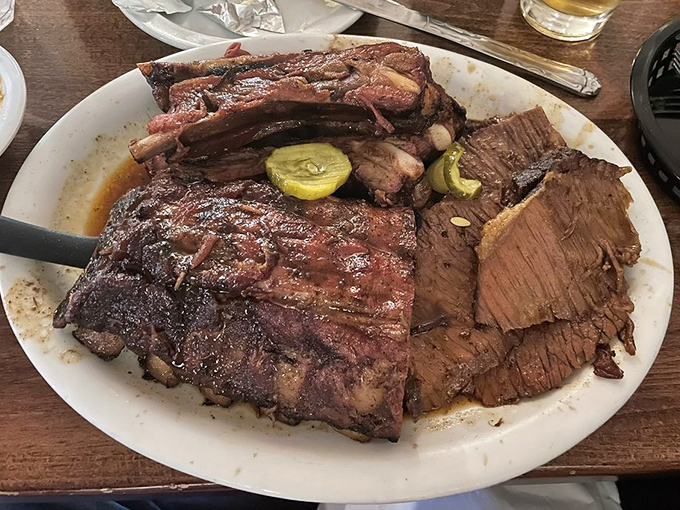 Behold the brisket and ribs platter&mdash;a meat mosaic that would make a Texan weep with joy. That bark has more character than most Hollywood scripts.