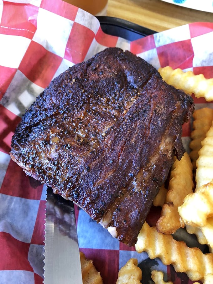 Ribs with a bark so perfect they should be in a museum. That smoke ring isn't just science - it's edible poetry.