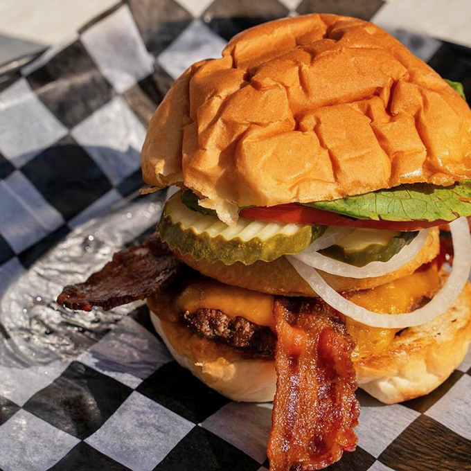 Architecture matters—especially when building the perfect burger. Note how the bacon creates structural support while adding that smoky counterpoint to the cheese.
