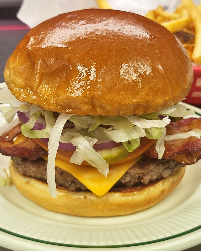 A burger that requires jaw-stretching commitment, with bacon playing both the supporting actor and scene-stealer in this delicious drama of American excess.