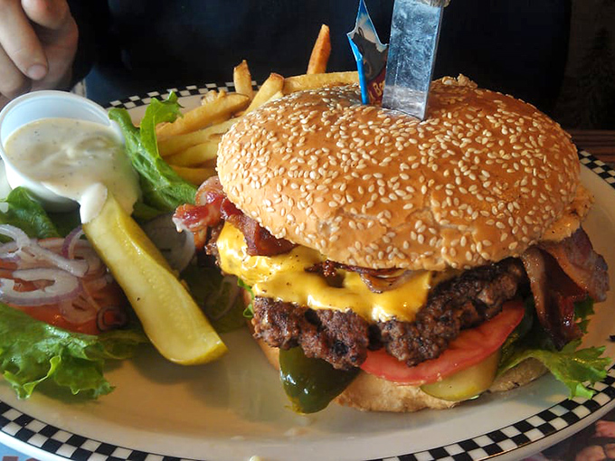 This burger doesn't just satisfy hunger—it obliterates it. The sesame seed bun barely containing its beefy magnificence like nature's perfect food pyramid.