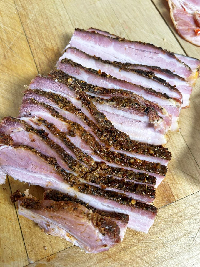 Bacon sliced so perfectly it should be hanging in an art gallery. This isn't your supermarket breakfast meat—it's pork perfection.