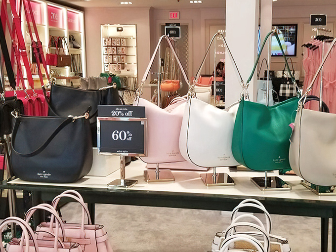 Kate Spade handbags stand at attention, their 60% off tags more attractive than their already gorgeous designs &ndash; proof that good taste and good sense can coexist.