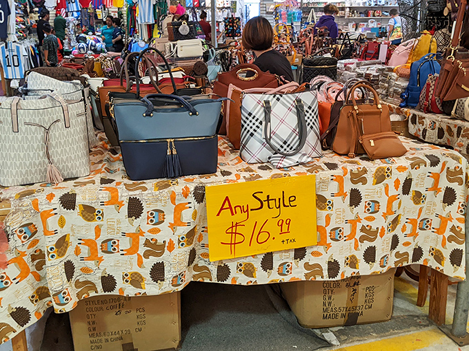 Handbag heaven! Designer-inspired purses await new owners at budget-friendly prices. That $16.99 sign is speaking directly to your wallet's love language.