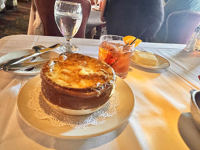 French onion soup that's worth the cheese pull photo op&mdash;a bubbling cauldron of comfort topped with golden, crusty perfection.
