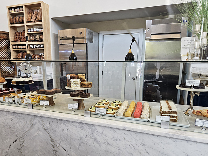 The pastry case at The Station on Kings—where willpower goes to die and diet resolutions are forgotten faster than New Year's gym memberships.