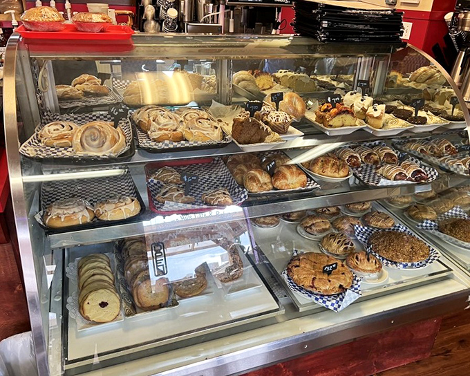 The bakery case&mdash;where willpower goes to die. Each shelf offers a different path to happiness, all involving butter and sugar.