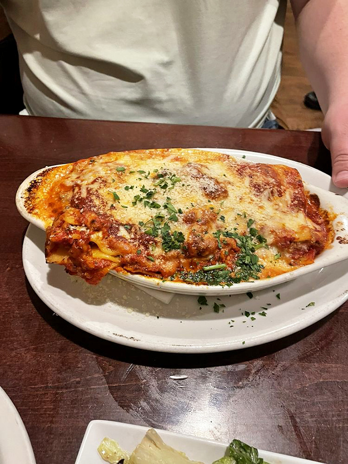 Lasagna that defies gravity&mdash;layers of pasta, cheese, and sauce creating a monument to excess that somehow maintains its structural integrity.