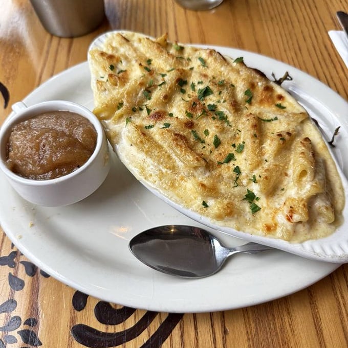 Mac and cheese elevated to art form—bubbling, golden, and served with a side of childhood memories upgraded for your sophisticated adult palate.