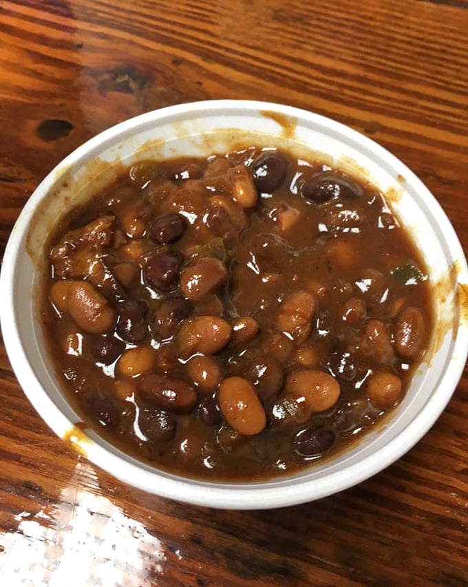 These baked beans have clearly been introduced to some smoky friends along the way &ndash; a neighborhood potluck in a single cup.