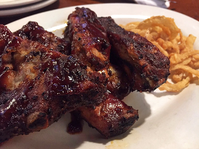 These ribs aren't falling off the bone&mdash;they're clinging to it just enough to remind you that proper barbecue requires a little work.