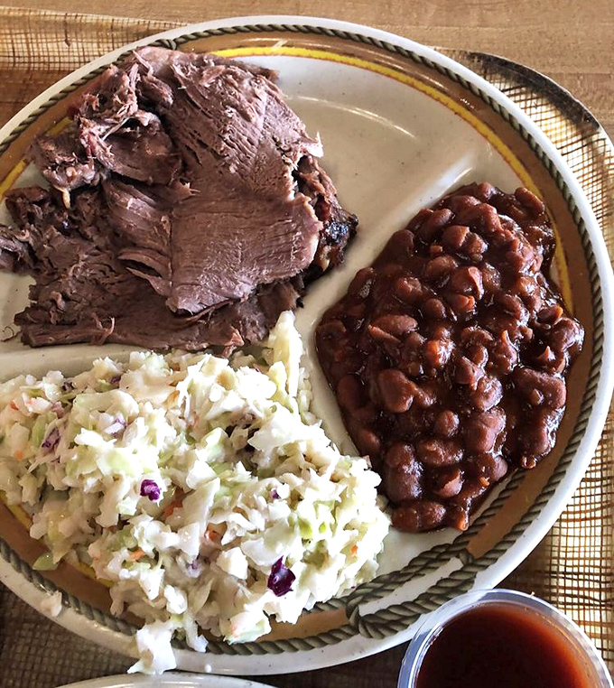 Brisket so tender it practically surrenders at the sight of your fork, paired with sides that refuse to be afterthoughts.