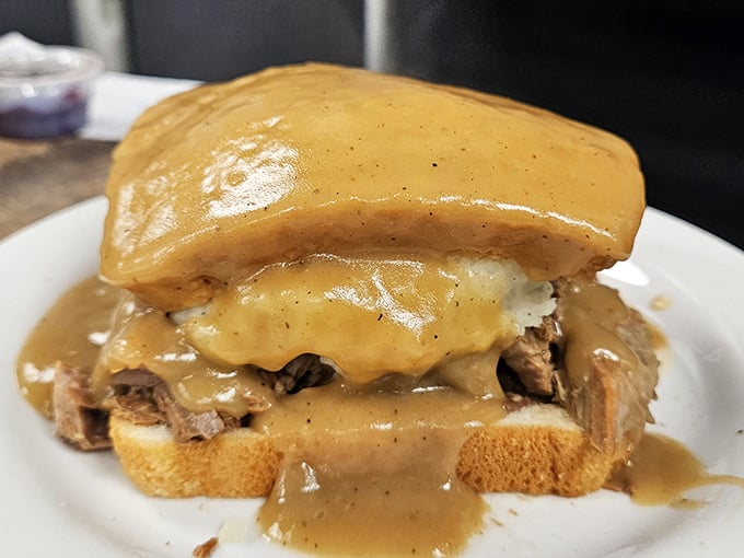 The Beef Manhattan&mdash;where tender roast beef meets mashed potatoes under a gravy waterfall. Comfort food architecture at its finest.