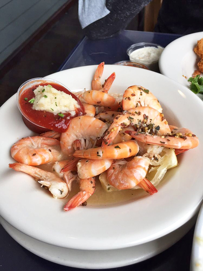 Plump shrimp that practically snap with freshness, arranged like they're posing for their seafood yearbook photo. That cocktail sauce isn't just a condiment&mdash;it's a statement.