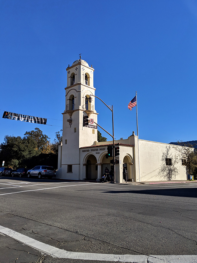 The post office tower catches golden hour light, standing tall since 1917&mdash;back when mail was exciting and Amazon was just a river.