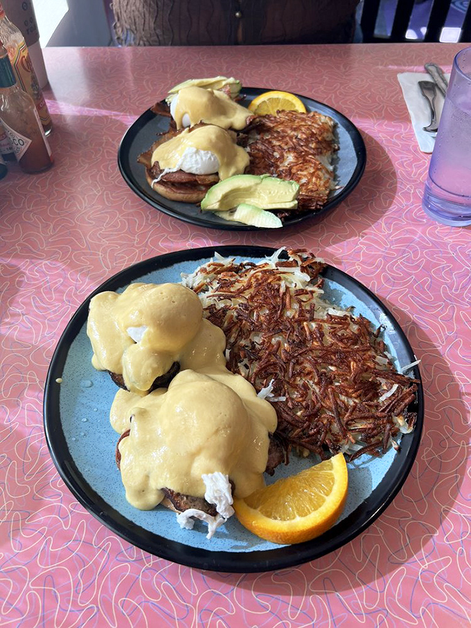 Eggs Benedict done right&mdash;hollandaise cascading like a golden waterfall over English muffins. Crispy hash browns standing guard on the side.