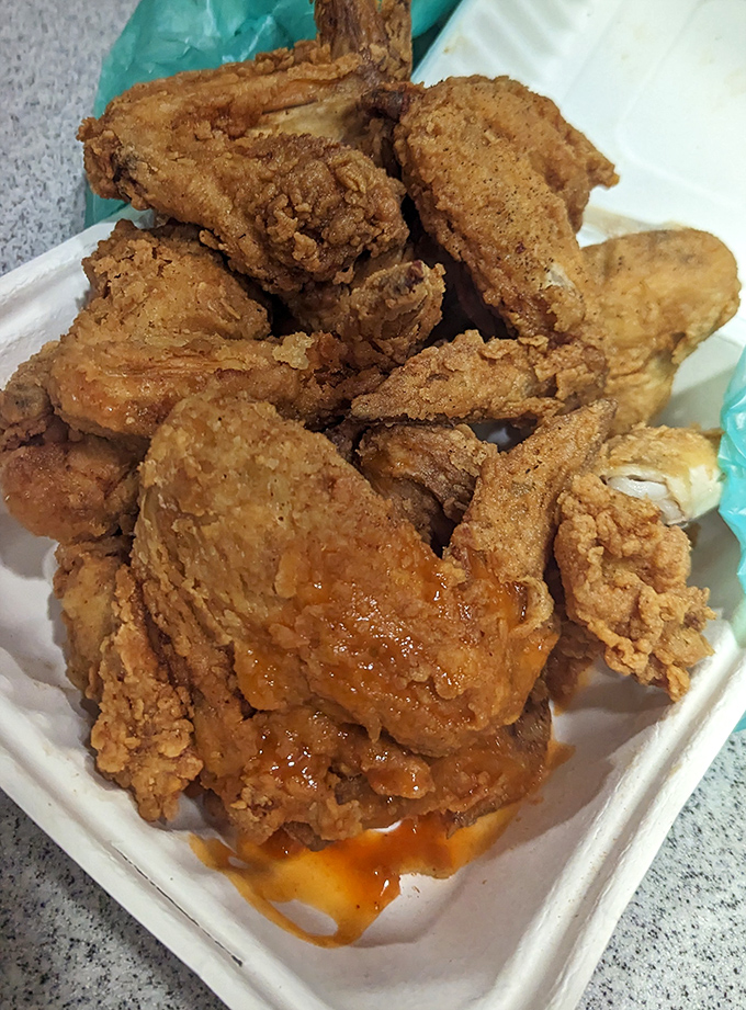 Crispy, juicy, and unapologetically straightforward. This mountain of fried chicken pieces isn't trying to impress you&mdash;yet somehow, it absolutely does.
