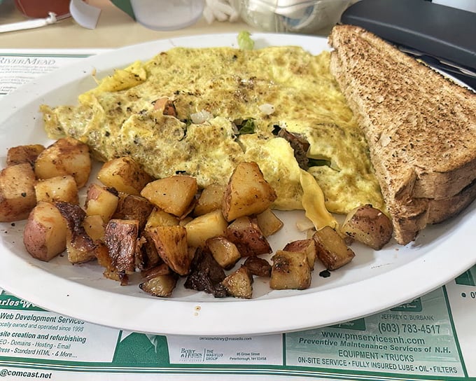 Breakfast architecture at its finest&mdash;a golden omelet surrounded by home fries that look like they've been tanned to perfection on a New Hampshire beach.