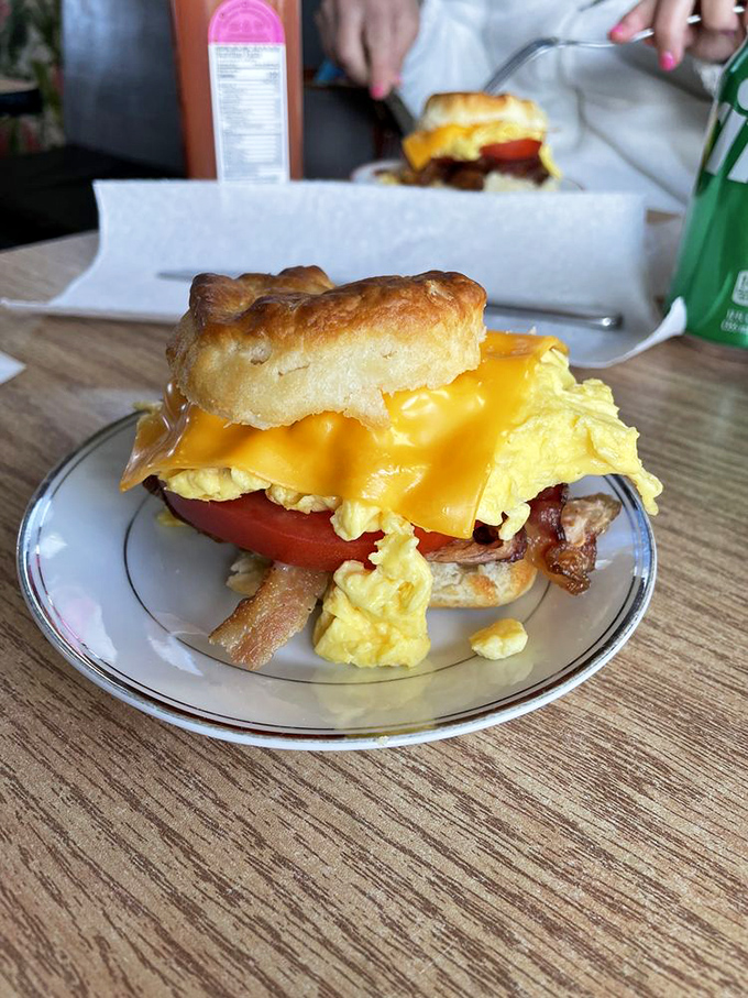 Breakfast sandwiches that make you question why anyone eats cereal. That golden biscuit practically glows with buttery promise.