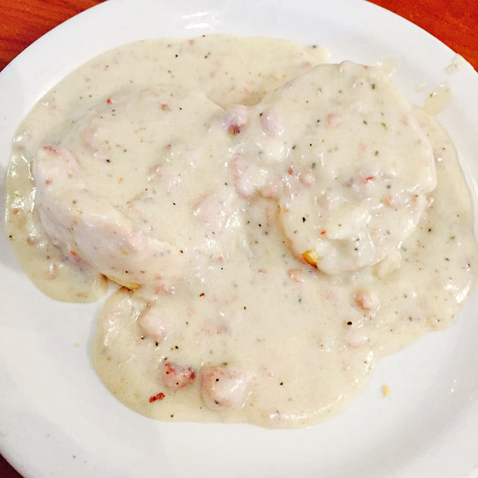 Biscuits drowning happily in gravy, like a warm hug from your Southern grandmother's kitchen.