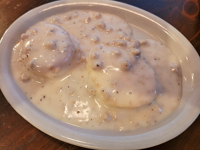 These biscuits and gravy look like they're wearing winter coats of creamy, peppery goodness. Breakfast nirvana achieved in spectacular fashion.
