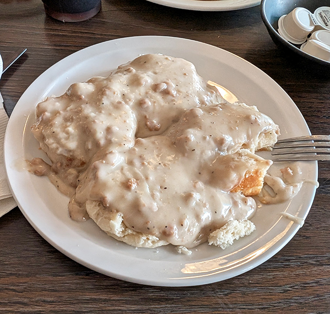 These biscuits and gravy aren't just a side dish&mdash;they're the main event, a creamy, peppery masterpiece that grandma would approve of.