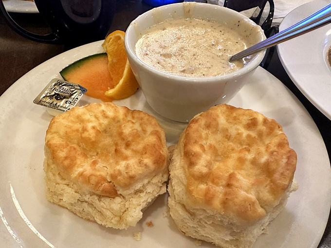 Biscuits so fluffy they could float away if not anchored by that perfect pepper-speckled sausage gravy.