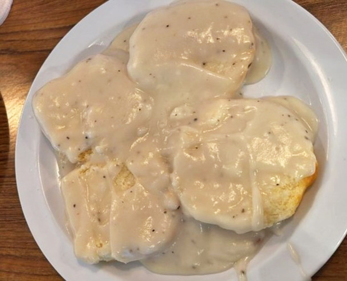 Southern comfort in its purest form. These biscuits, smothered in creamy sausage gravy, have probably prevented more bad days than therapy.
