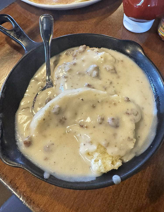 This isn't just biscuits and gravy&mdash;it's a cast iron skillet of Southern salvation, with cream gravy thick enough to stand a spoon in.
