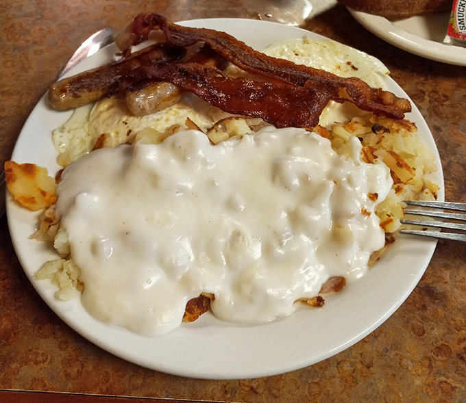 Fluffy biscuits drowning in sausage gravy - comfort food that hugs your soul from the inside out.