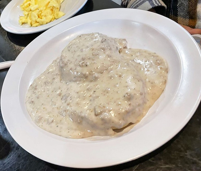 Biscuits and gravy so creamy they should require a permission slip. This plate doesn't whisper "comfort food"&mdash;it belts it out like Aretha Franklin.