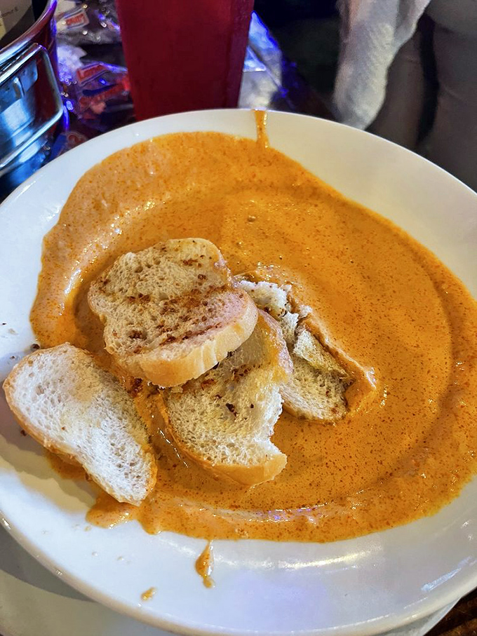 This bisque isn't just soup&mdash;it's a warm, spicy hug in a bowl that makes you want to write poetry about seafood.