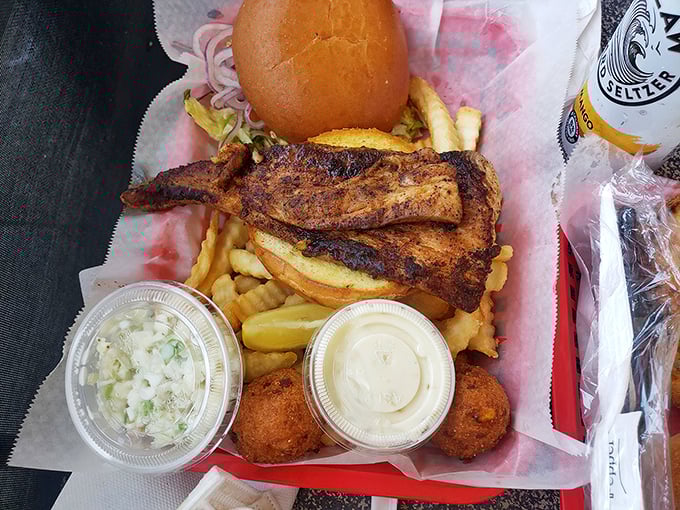 This blackened fish sandwich isn't just lunch&mdash;it's a coastal ritual. The fries and hush puppies are merely supporting actors in this seafood drama.