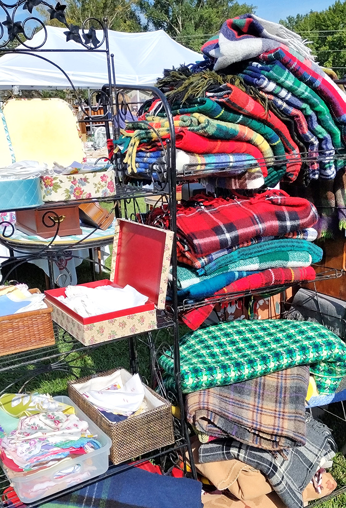 Wool blankets in every pattern imaginable create a textile library. These aren't just blankets&mdash;they're portable time machines to grandma's living room.