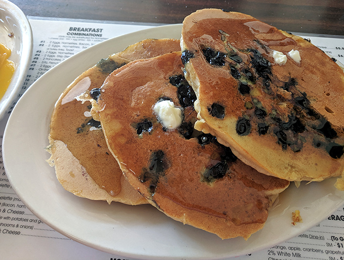 Blueberry pancakes that make you question why you ever settled for lesser versions. Each berry is like a tiny flavor bomb.