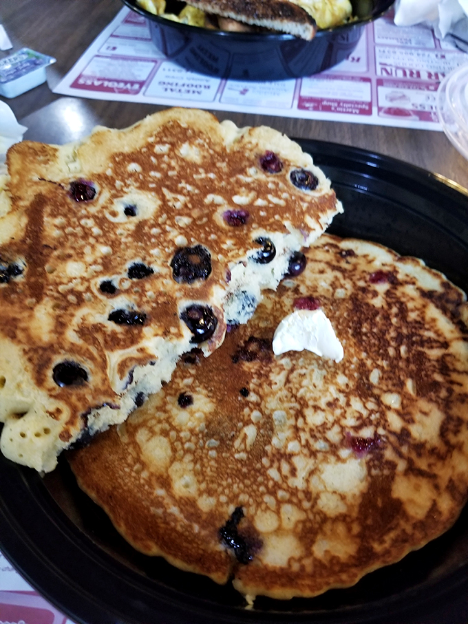 Blueberry pancakes that could make IHOP executives lose sleep. Golden-brown with bursts of fruit that pop like tiny flavor bombs with each bite.