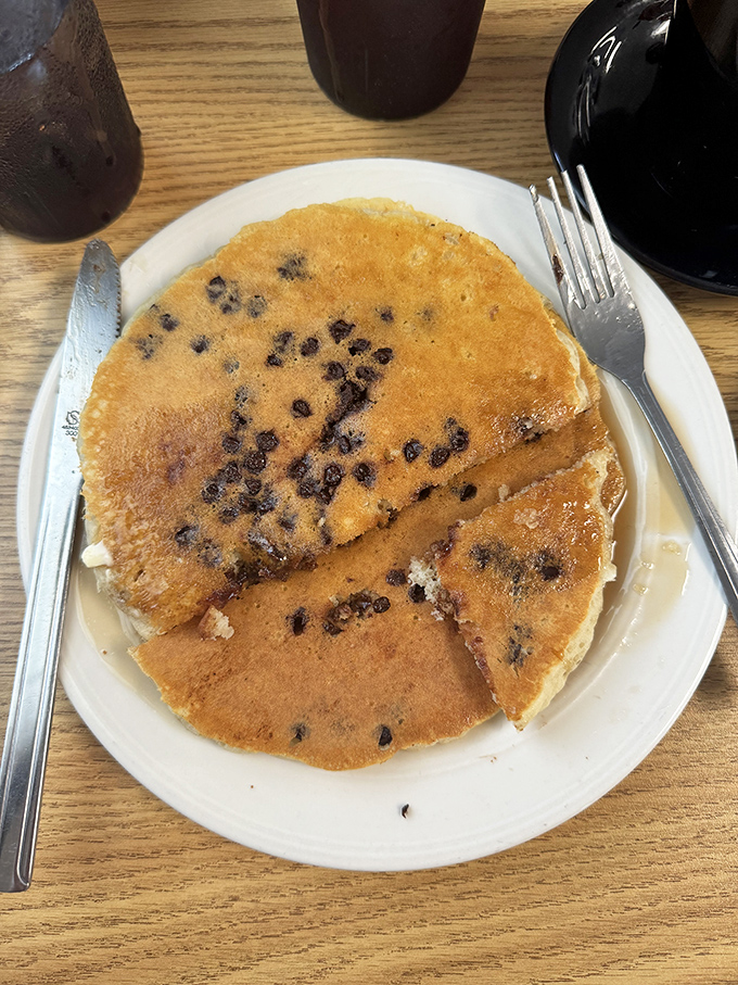These blueberry-studded pancakes look like tiny bursts of summer sunshine decided to take up residence on your plate.