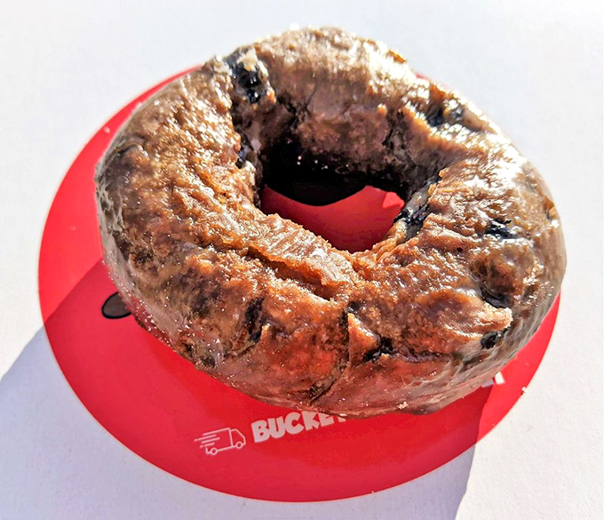 Blueberry bliss on a red plate. This glazed beauty has the power to turn the worst morning into something worth celebrating.