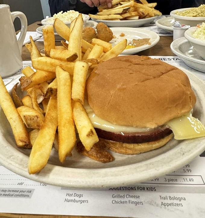 This isn't just a Bologna sandwich; it's a masterclass in simplicity. Golden fries that crunch like autumn leaves underfoot&mdash;pure potato perfection.
