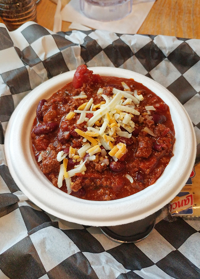 This isn't just chili—it's a spicy, meaty revelation topped with melted cheese that makes winter days bearable and summer days worthwhile.