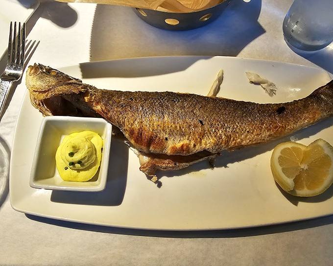 A whole branzino that makes you understand why people write songs about the sea. Simple, perfect, and worth every moment of that awkward eye contact.