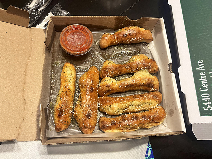 Garlic breadsticks that would make an Italian grandmother nod in approval. Perfectly baked, generously seasoned, and ready for dunking.