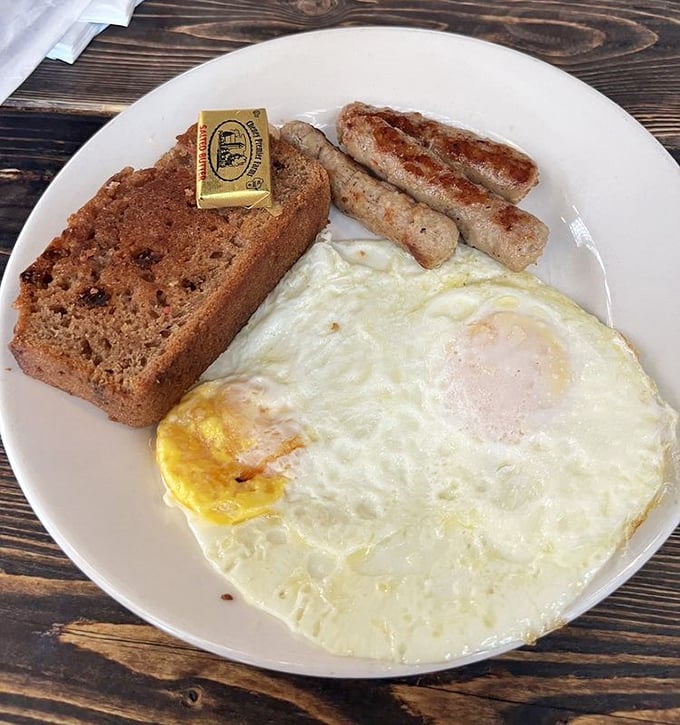 Breakfast perfection doesn't need to be complicated &ndash; just a perfectly cooked sunny-side-up egg, homemade bread, and sausage links that snap when bitten.
