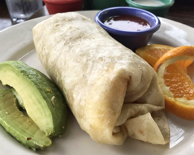 The breakfast burrito&mdash;nature's perfect food delivery system. Avocado on the side because California wouldn't have it any other way.